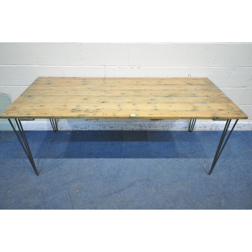 AN UPCYCLED RECTANGULAR PINE TABLE, constructed from a gate, raised on ...