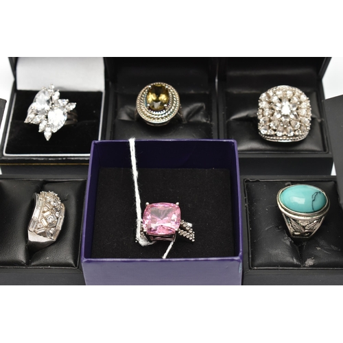 SIX BOXED WHITE METAL RINGS, various designs each set with stones to ...