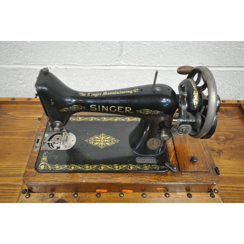 A SINGER MANUFACTURING COMPANY TREADLE SEWING MACHINE BASE, with a ...