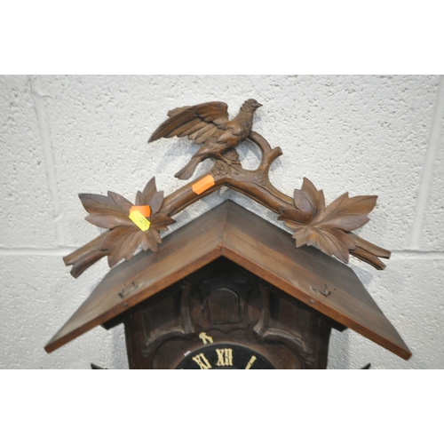 A 20TH CENTURY OAK CUCKOO CLOCK, the 5 inch dial depicting Roman ...