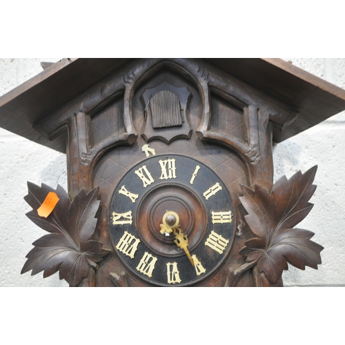 A 20TH CENTURY OAK CUCKOO CLOCK, the 5 inch dial depicting Roman ...