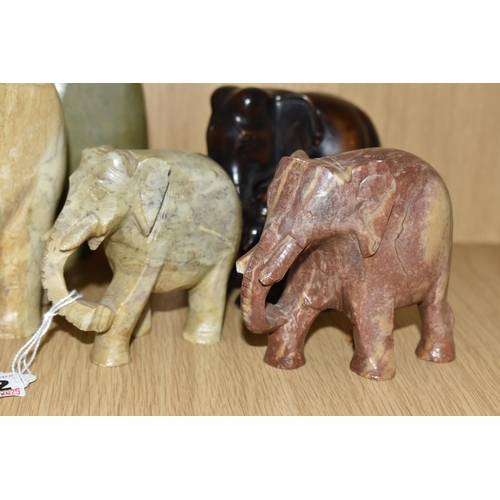 A GROUP OF ELEPHANT SCULPTURES AND CARVED SPHERES comprising two carved ...