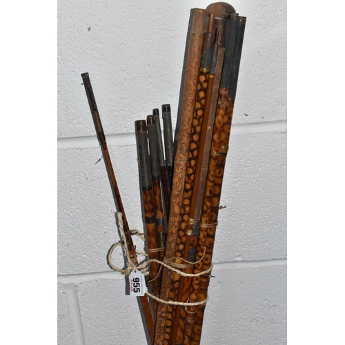 A GROUP OF FIVE VINTAGE FISHING RODS AND COVERS to include a four-piece ...