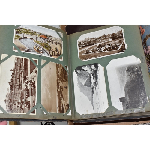 FOUR ALBUMS OF POSTCARDS containing approximately 642 early 20th ...