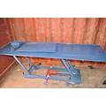 A HYDRAULIC MOTORCYCLE LIFT with front wheel clamp, tail board and rear ...