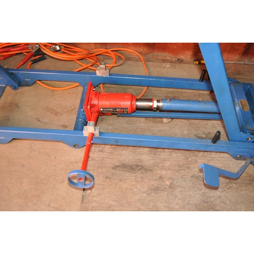 A HYDRAULIC MOTORCYCLE LIFT with front wheel clamp, tail board and rear ...