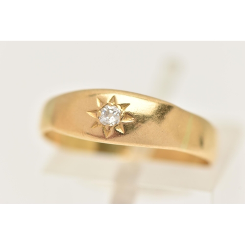 A YELLOW METAL STAR SET DIAMOND RING, star set with a small old cut ...