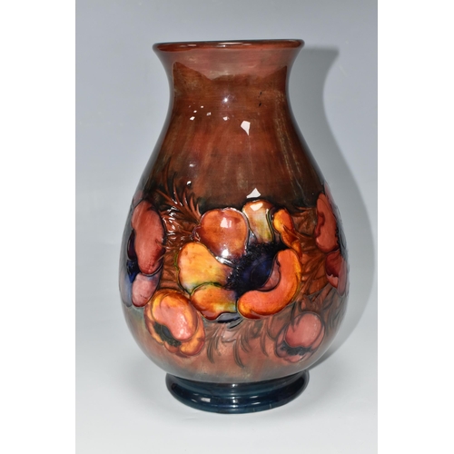 A MOORCROFT 'FLAMBE ANEMONE' BALUSTER VASE with a tube lined anemone ...