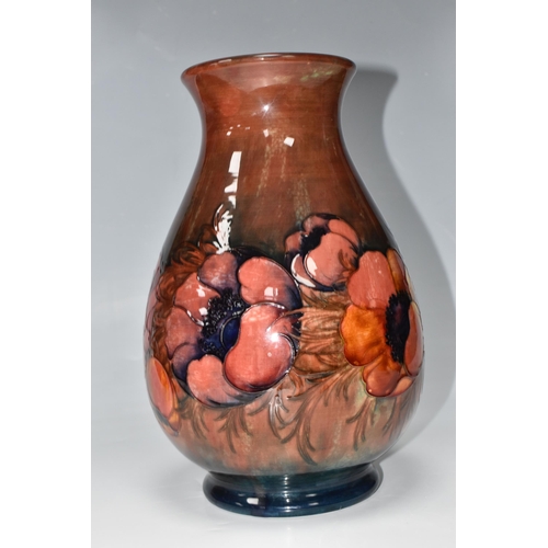 A MOORCROFT 'FLAMBE ANEMONE' BALUSTER VASE with a tube lined anemone ...