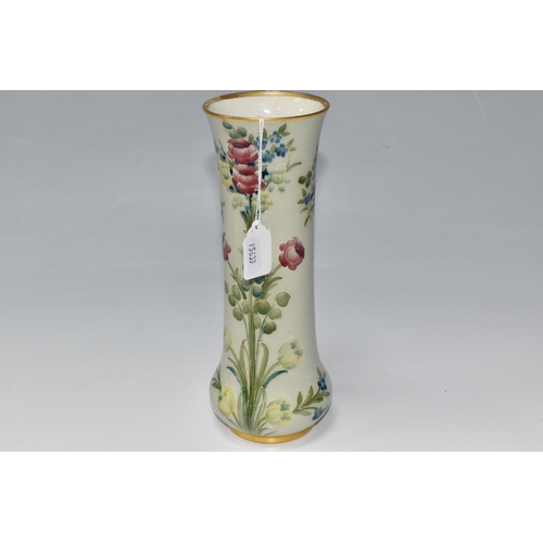 A WILLIAM MOORCROFT FOR MACINTYRE VASE with a tube lined forget-me-not ...