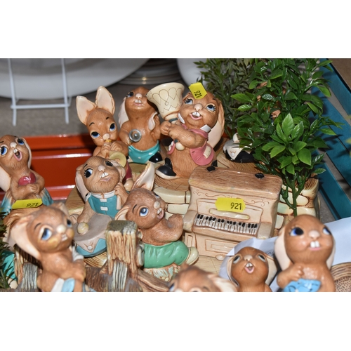 A LARGE COLLECTION OF PENDELFIN RABBITS AND STANDS comprising seven ...