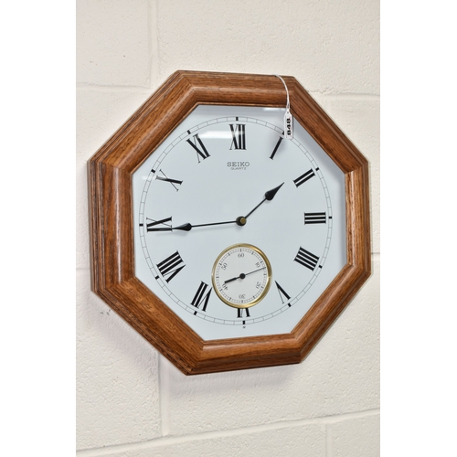A BOXED SEIKO QUARTZ WALL CLOCK of octagonal form, with a second dial ...