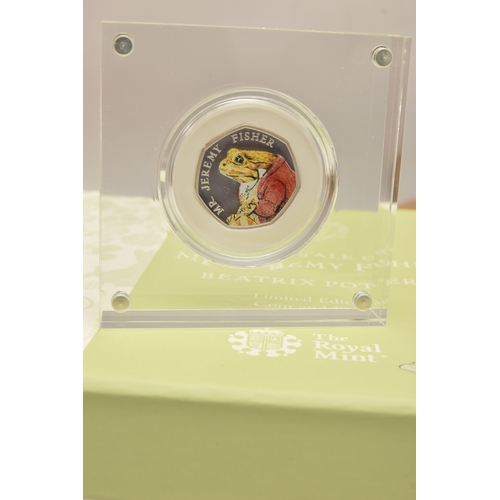 A CARDBOARD BOX CONTAINING ROYAL MINT LIMITED EDITION COIN AND BOOK ...