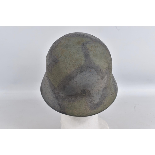A GERMAN M35 STEEL HELMET WITH LINER AND CHINSTRAP, this was originally ...