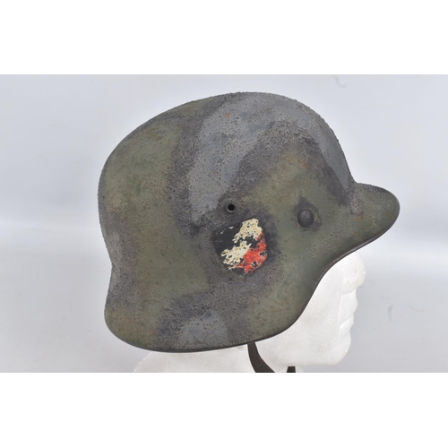 A GERMAN M35 STEEL HELMET WITH LINER AND CHINSTRAP, this was originally ...