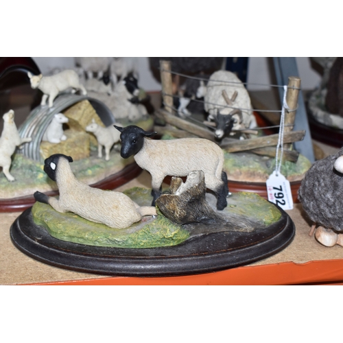 A COLLECTION OF SHEEP THEMED ORNAMENTS to include three ceramic sheep ...