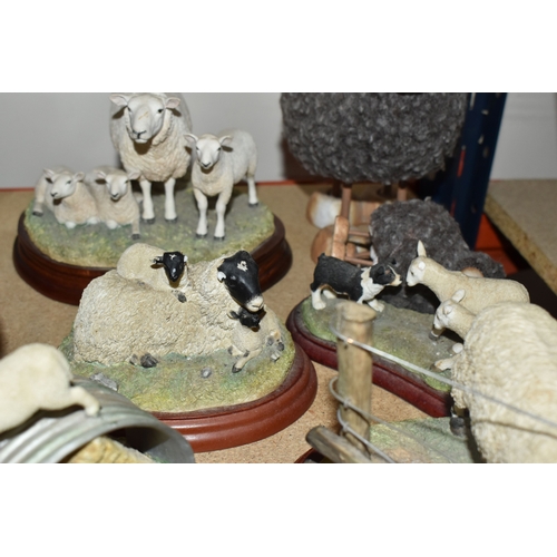 A COLLECTION OF SHEEP THEMED ORNAMENTS to include three ceramic sheep ...