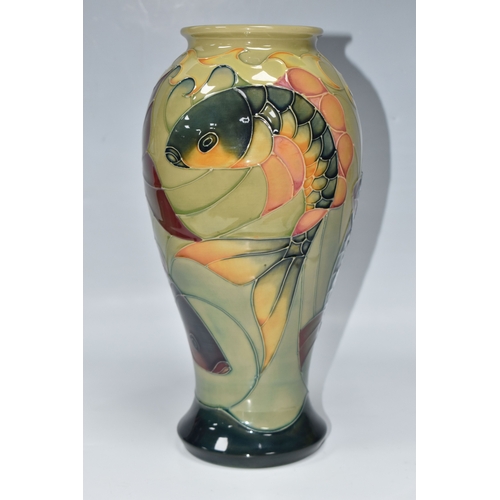 A BOXED MOORCROFT POTTERY 'CARP' PATTERN VASE, of baluster form, tube ...