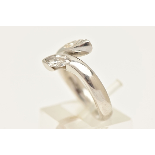 A CONTEMPORARY 'PAUL SPURGEON' DIAMOND TWO STONE RING, a platinum ...