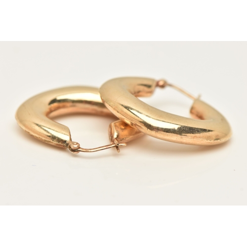 A PAIR OF 9CT GOLD HOOP EARRINGS, a pair of yellow gold hollow creole ...