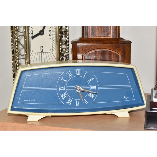 A GROUP OF CLOCKS, comprising a USSR Vega faceted mantel clock, a Majak ...
