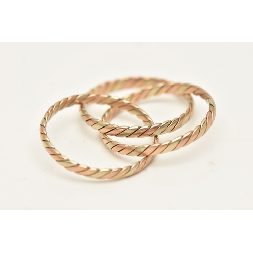 A TRI COLOUR INTERLOCKING BAND RING, three tri colour bands ...