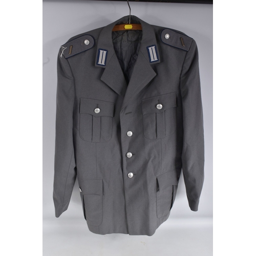 FOUR GERMAN UNIFORM DRESS JACKETS WITH INSIGNIA, these include an Army ...