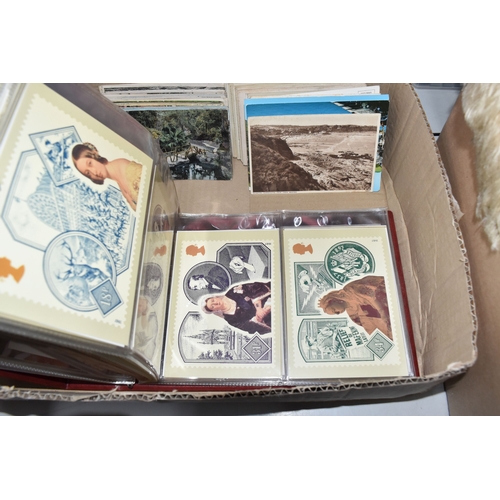 A BOX OF POSTCARDS, to include two albums and loose postcards ...