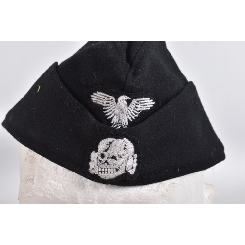 THREE GERMAN SIDE CAPS AND TWO ARM BANDS, two caps have an Eagle and a ...