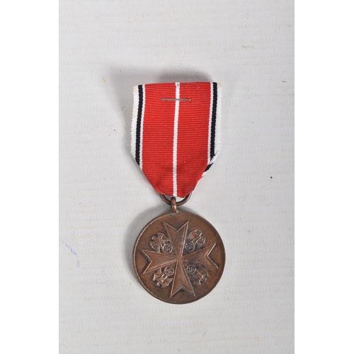 TWO WWII ERA GERMAN AWARDS, to include a SS Long Service medal and an ...