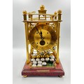 A late 20th century brass spherical weight clock, by Harding & Bazeley ...