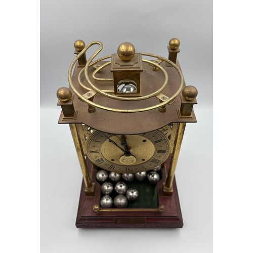 A late 20th century brass spherical weight clock, by Harding & Bazeley ...