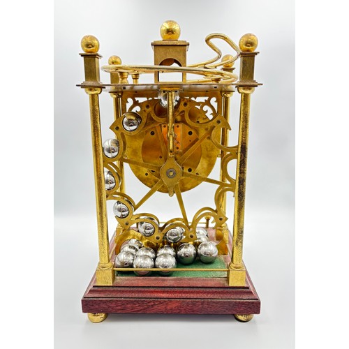 A late 20th century brass spherical weight clock, by Harding & Bazeley ...