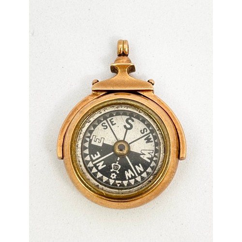 9ct Gold swivel compass pendant marked 375 to the top Total Weight - 7.34g