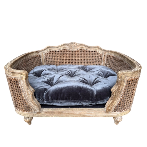 HarrodsContemporaryA 'Lord Lou' cane work and washed wood dog ...