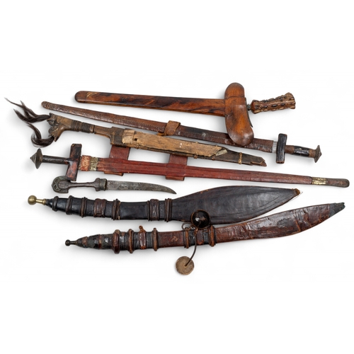 A group of seven swordsTo include:[a] North African, Two Tuareg swords ...