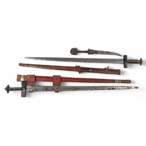 A group of seven swordsTo include:[a] North African, Two Tuareg swords ...