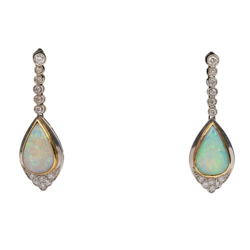 A pair of opal and diamond pendant earringsThe pear-shaped opals ...