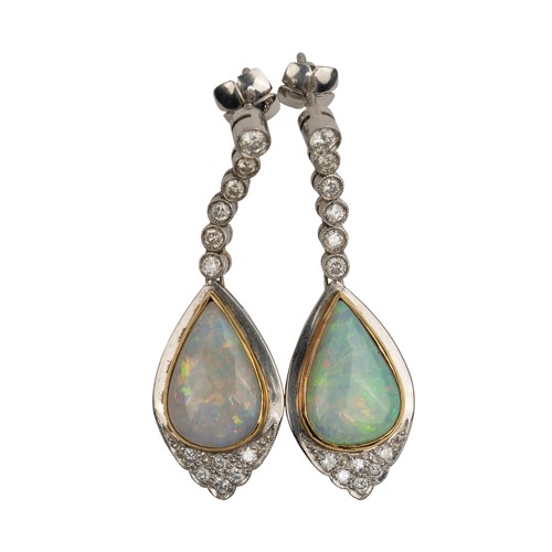 A pair of opal and diamond pendant earringsThe pear-shaped opals ...