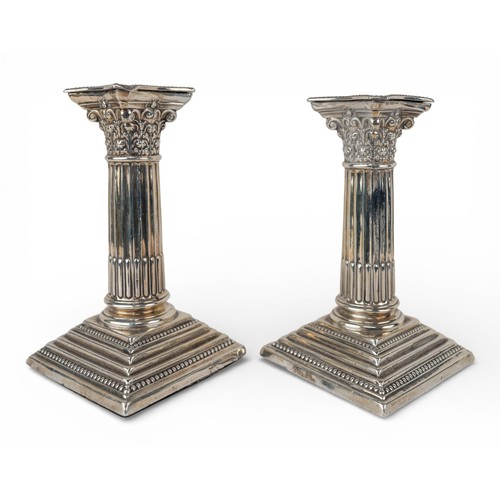 A pair of small silver Corinthian column candlesticksBy William Hutton ...