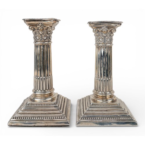 A pair of small silver Corinthian column candlesticksBy William Hutton ...