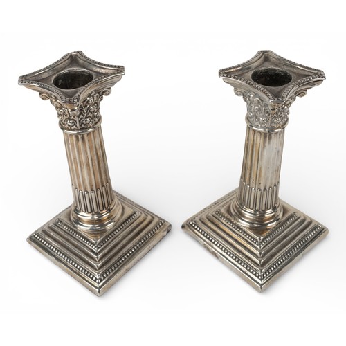 A pair of small silver Corinthian column candlesticksBy William Hutton ...
