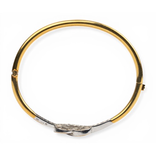 A yellow gold, platinum and diamond lovers' heart bangleSet to the ...