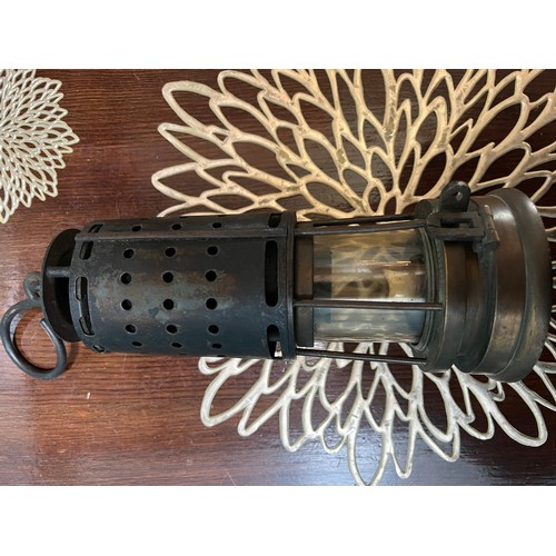 Superb example of miners Davey lamp with 2 x vintage pit helmets