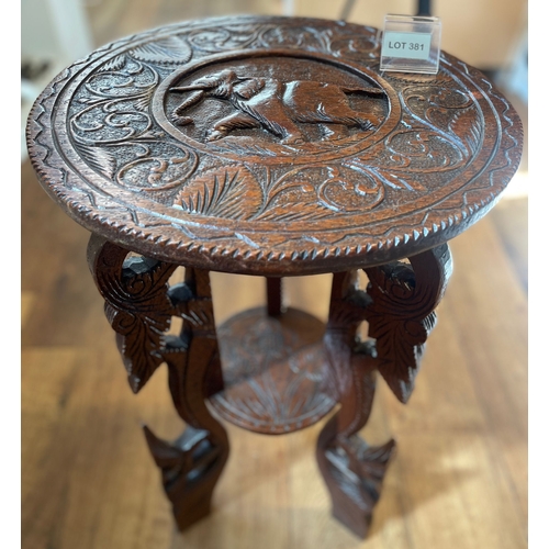 Heavily carved African side table depicting an elephant