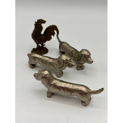 Four Little Metallic Animal Figures , Three Dogs, One Cockerill.