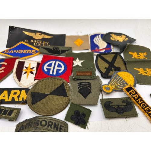 Collection Of Military Cloth Badges.