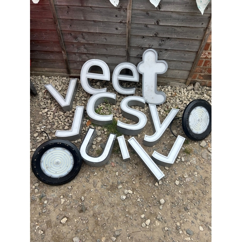 A Collection of Contemporary Illuminated Commercial Signage Components ...