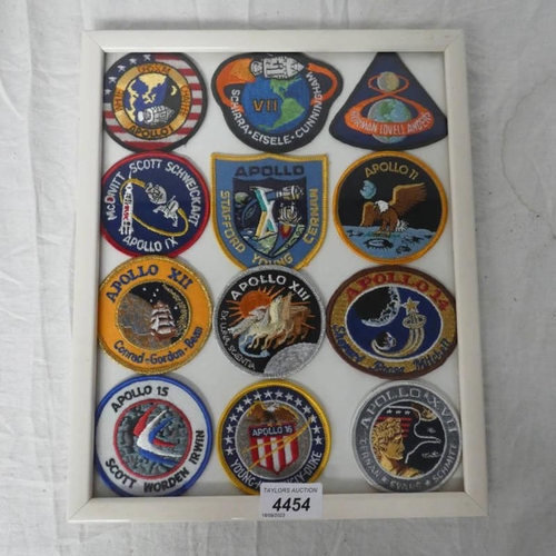 TWELVE FRAMED APOLLO SPACE MISSION PATCHES