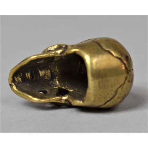 A Bronze Netsuke In the Form of a Skull